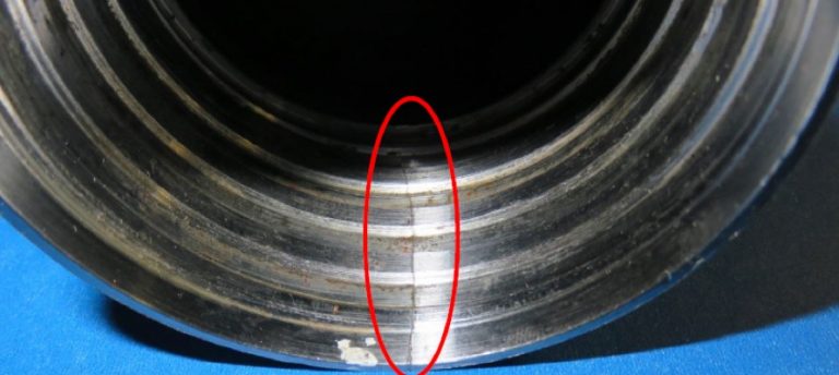 Heat check crack protruding through shoulder and across threads - Boart ...